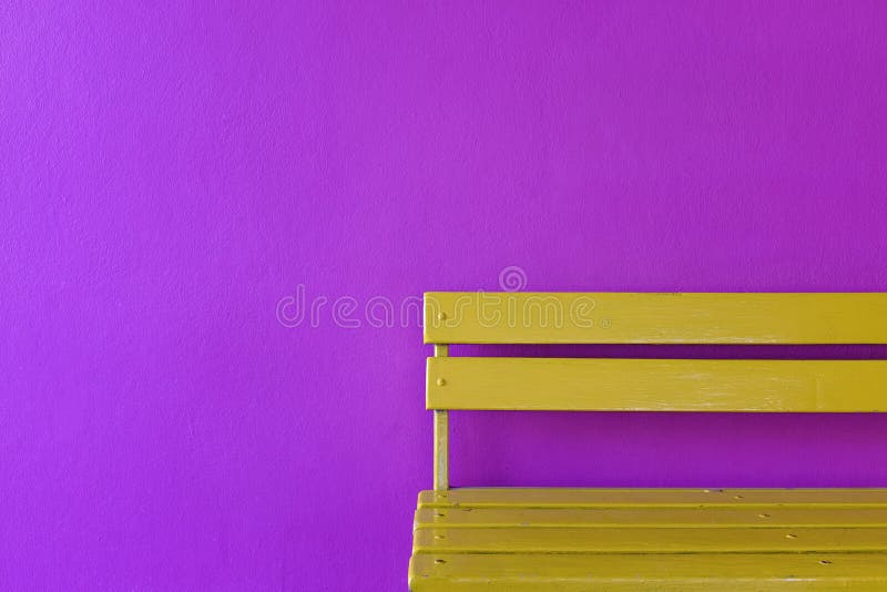 Yellow Wood Bench on Vivid Violet Wall Background Stock Photo - Image ...