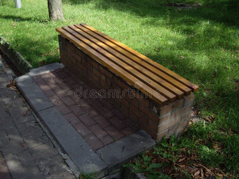 Yellow Wooden Bench in the Shade of the Park Trees Stock Image - Image ...