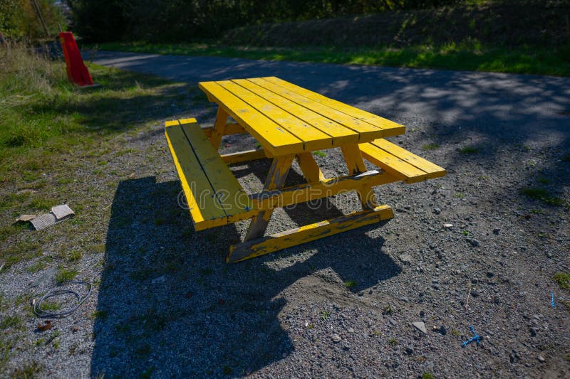 Yellow Wooden Park Bench by the Side of a Road.. Stock Photo - Image of ...