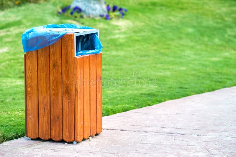 Yellow Wooden Trash Can Outdoors on the Side of Sidewalk in Park ...