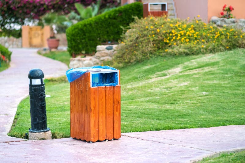 Yellow Wooden Trash Can Outdoors on the Side of Sidewalk in Park ...