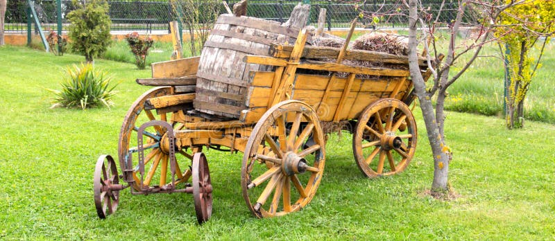 Yellow Wooden Wagon with Painted Wheels. Stock Photo - Image of farming ...