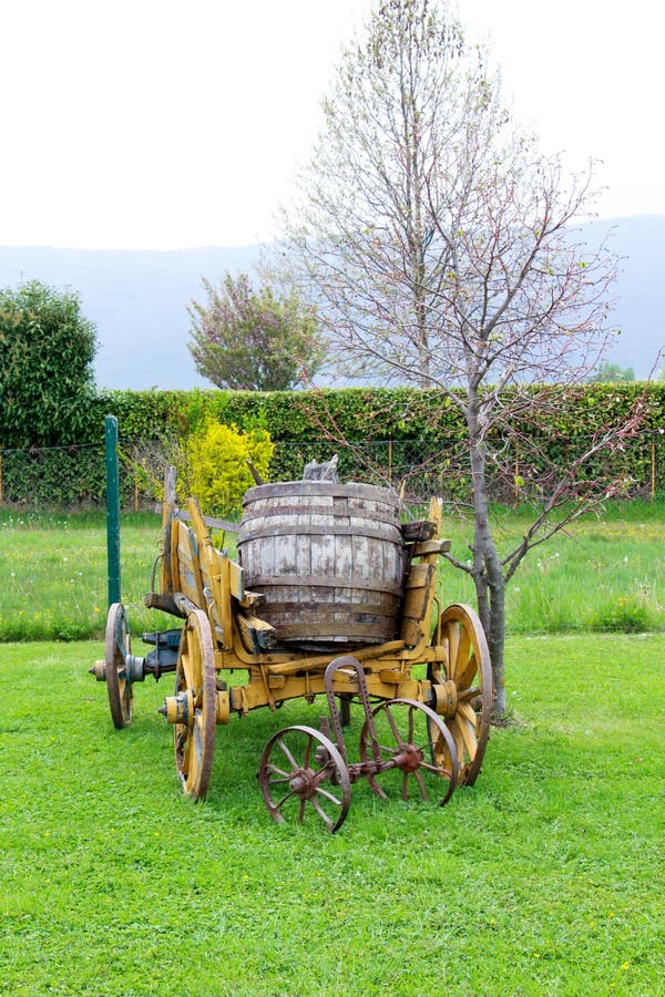 Yellow Wooden Wagon with Painted Wheels. Stock Photo - Image of grass ...