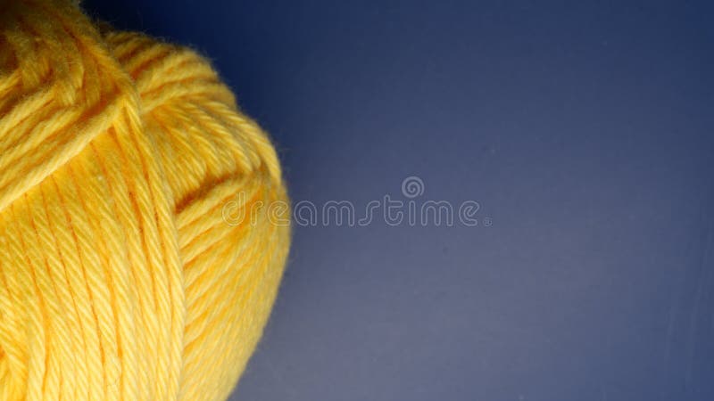 Yellow Wool for Knitting and Crocheting on a Blue Background Stock ...