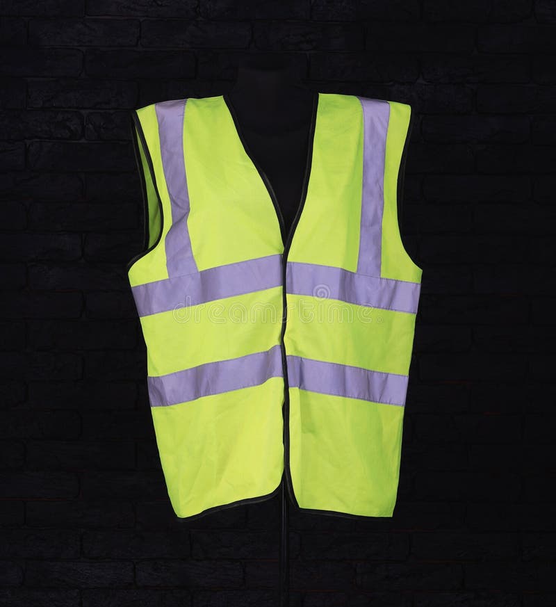 Yellow Work Vest on Mannequin Stock Photo - Image of isolated, safety ...