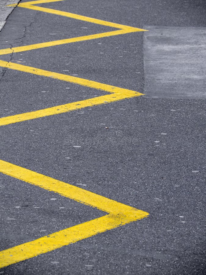Yellow Zigzag Road Markings on Asphalt Stock Image - Image of bitumen ...