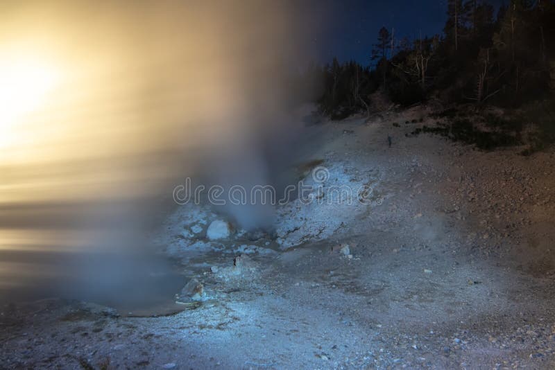 Yellowstone Geysers Erupting at Night Illuminated by Light Stock Image ...