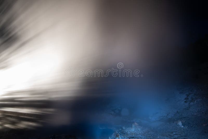 Yellowstone Geysers Erupting at Night Illuminated by Light Stock Photo ...