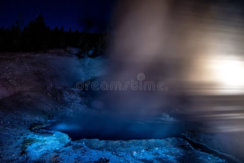 Yellowstone Geysers Erupting at Night Illuminated by Light Stock Image ...