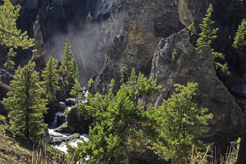 In Yellowstone, Water Flows through a Ravine and Around Rocks. Stock ...