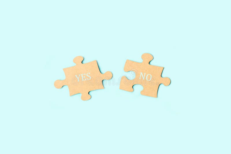 Yes and No Single Words Written on Brown Puzzle Pieces on a Light Blue ...