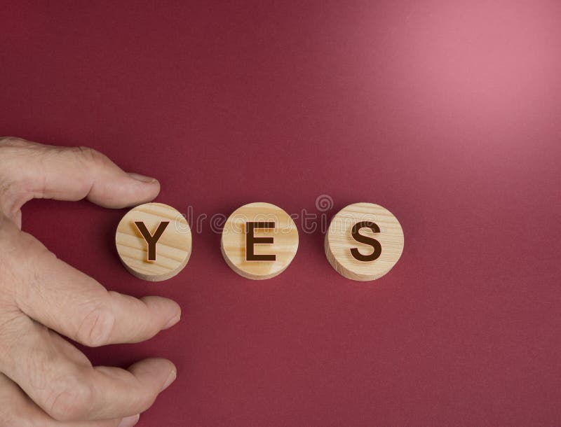 Yes Sign on a Wooden Circles on a Red Stock Photo - Image of card ...