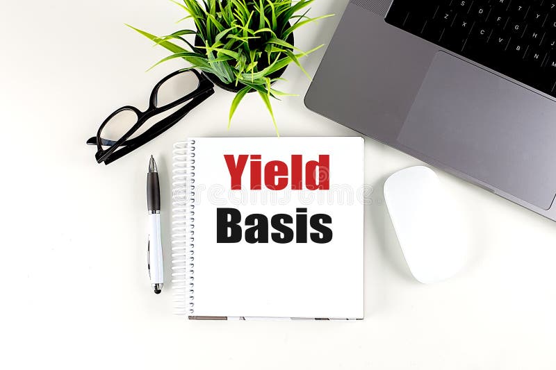 YIELD BASIS Text on Notebook with Laptop, Mouse and Pen Stock Image ...