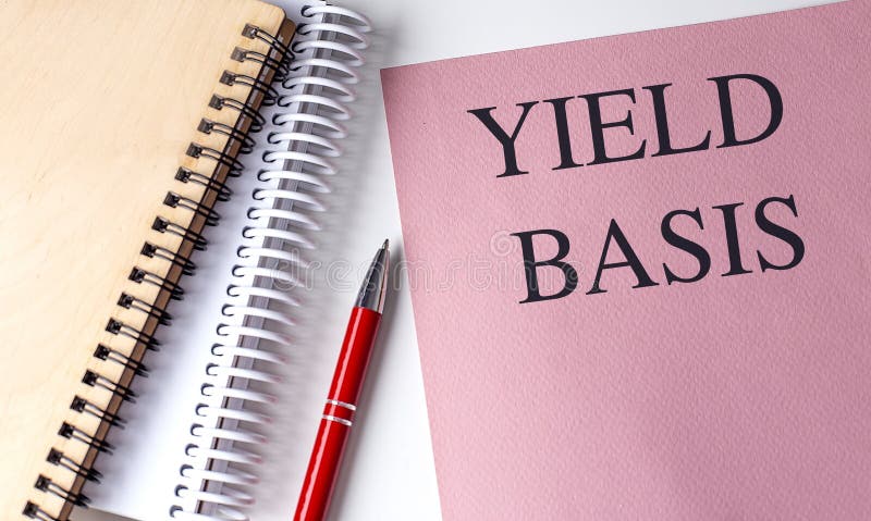 YIELD BASIS Text on Pink Paper with Notebooks Stock Photo - Image of ...