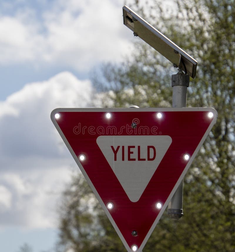 A Yield Sign with Led Lights on the Edges Stock Image - Image of blue ...