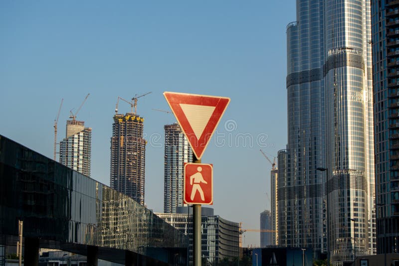 Yield Sign with Skyscrapers in Background Editorial Photography - Image ...
