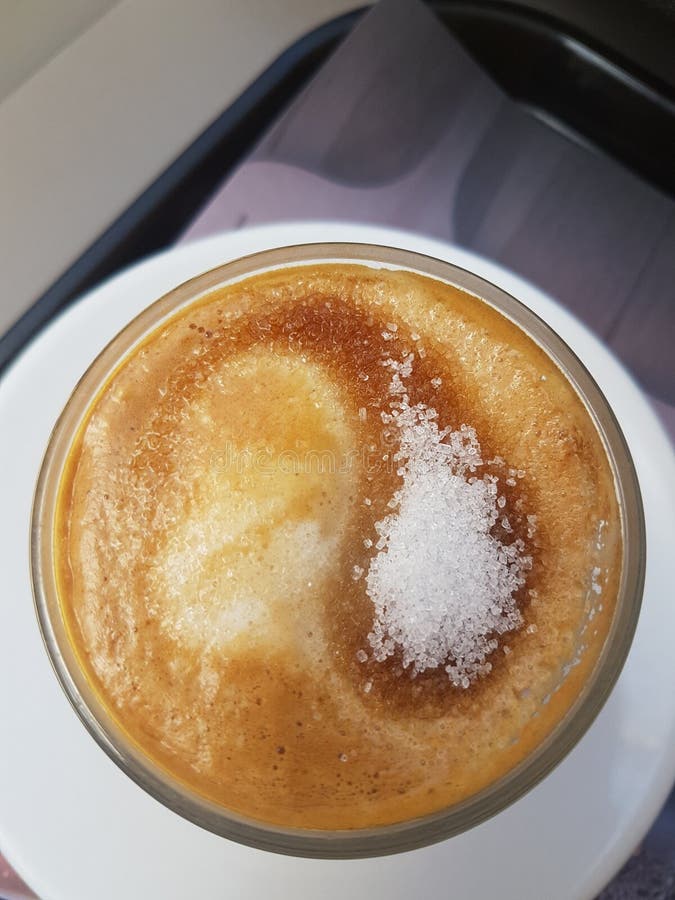 Yin yang coffee with milk stock image. Image of latte - 242473897