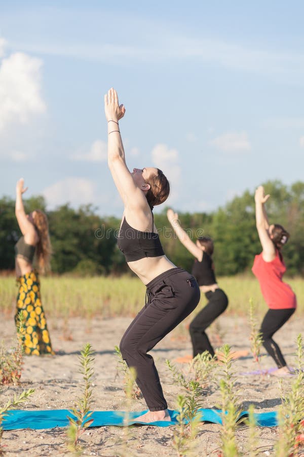 Group outdoor yoga class stock image. Image of fitness - 124694363