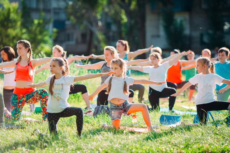 Yoga Classes Outside on the Open Air. Kids Yoga, Stock Photo - Image of ...