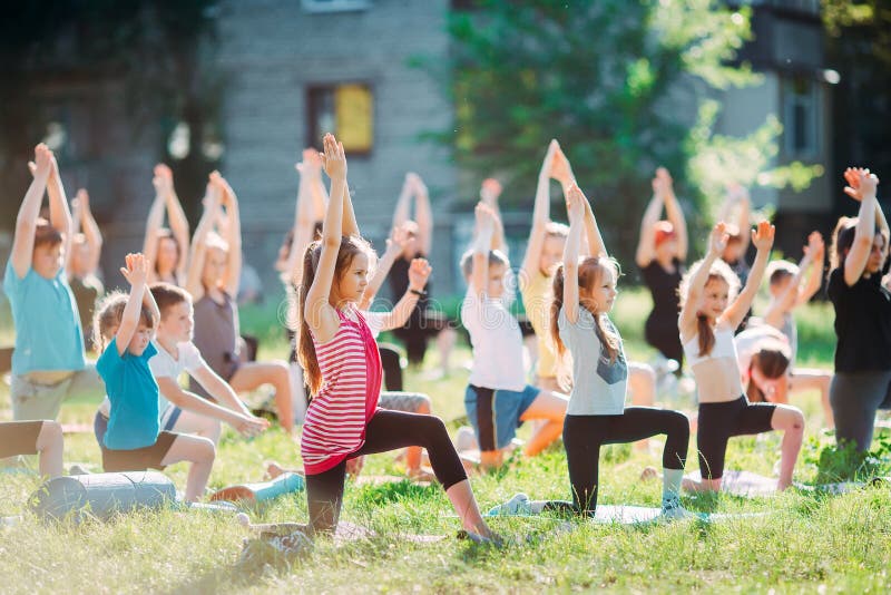 Yoga Classes Outside on the Open Air. Kids Yoga, Stock Photo - Image of ...