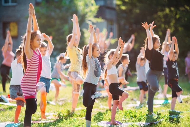 Yoga Classes Outside on the Open Air. Kids Yoga, Stock Image - Image of ...