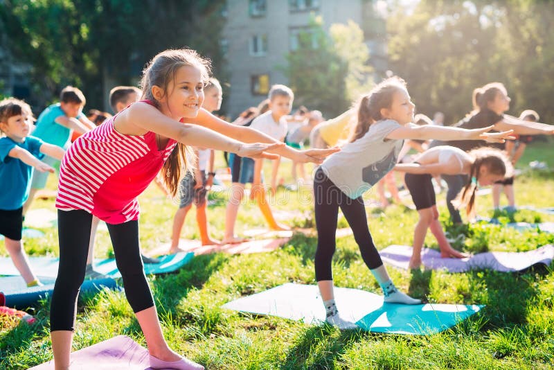 Yoga Classes Outside on the Open Air. Kids Yoga, Stock Image - Image of ...