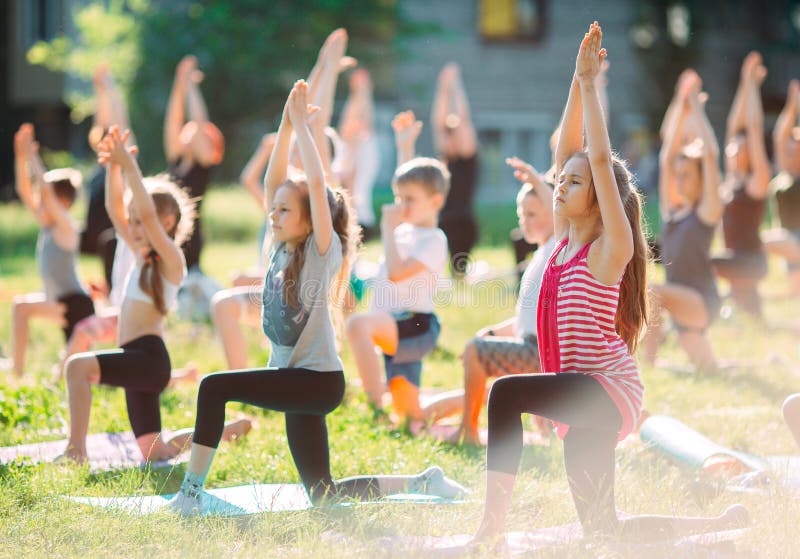Yoga Classes Outside on the Open Air. Kids Yoga, Stock Photo - Image of ...