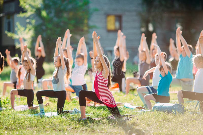 Yoga Classes Outside on the Open Air. Kids Yoga, Stock Photo - Image of ...