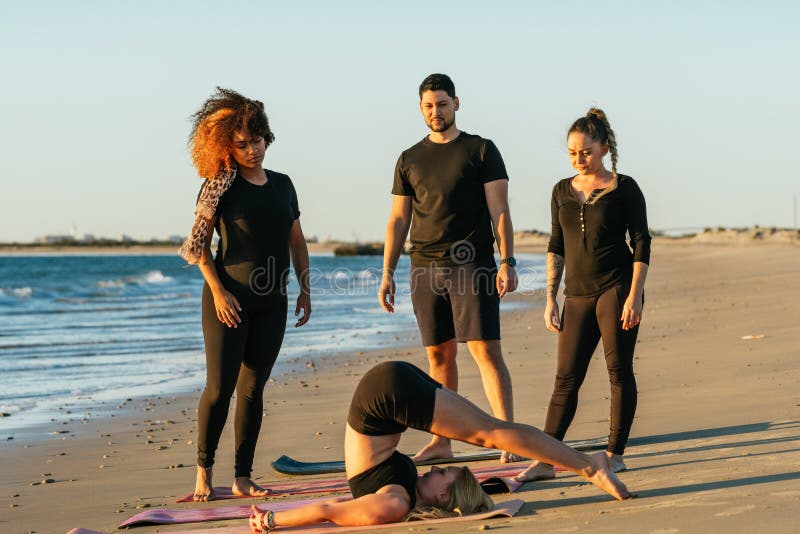 Yoga Coach Showing a Pose of Yoga To the Class during a Outdoor Session ...