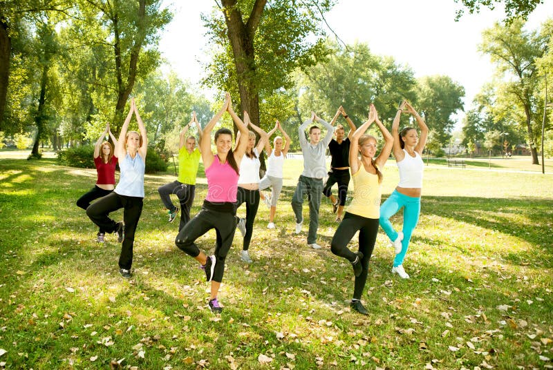 Yoga group, tree position, stock photo. Image of outside - 21744044