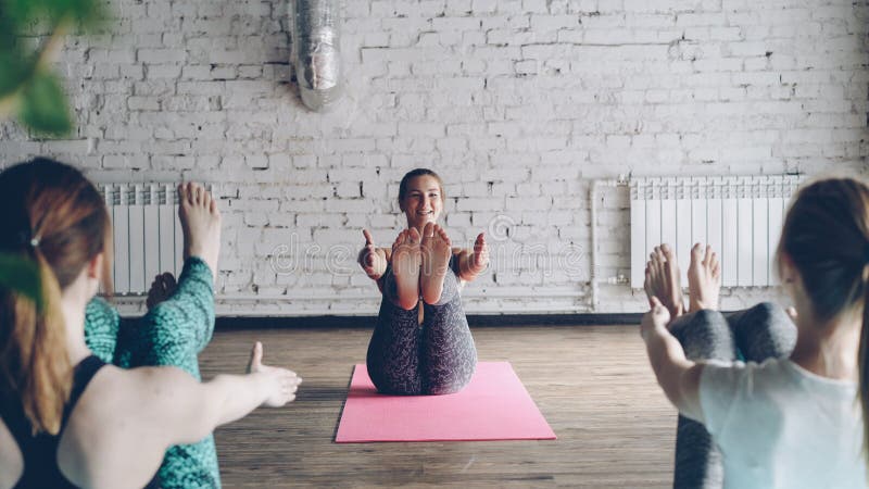 Yoga Instructor is Demonstrating Different Variations of Boat Pose ...