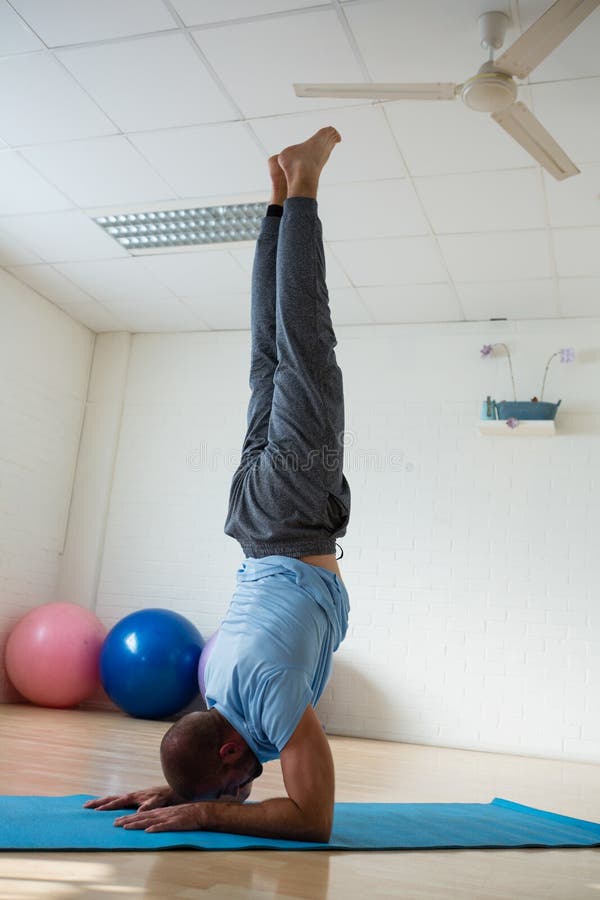 Yoga Instructor Doing Forearm Stand at Health Club Stock Photo - Image ...