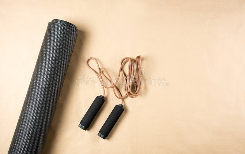 Yoga Mat and Leather Jumping Rope Stock Image - Image of gymnastics ...