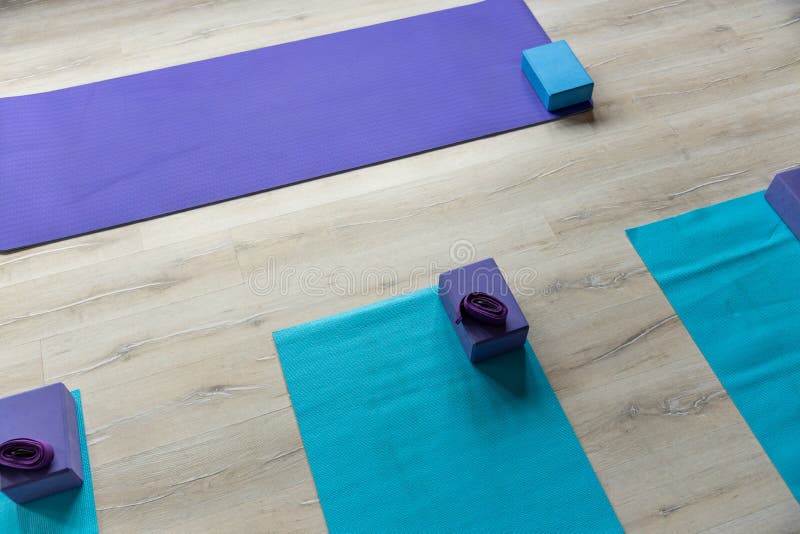 Yoga Mats with Blocks and Belts Placed on Floor in Studio Stock Image ...