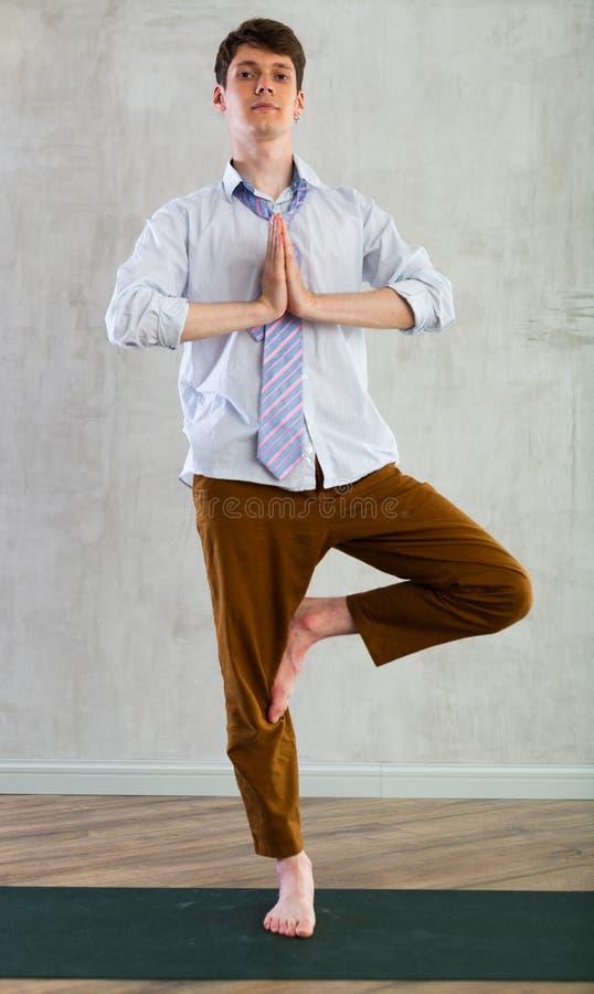Yoga for Office Workers - Man Practicing Yoga in Office Stock Photo ...
