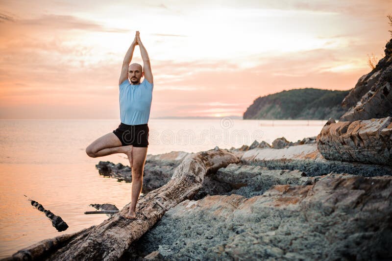 Yoga Posture on Sunset by Man Stock Image - Image of balancing, mind ...