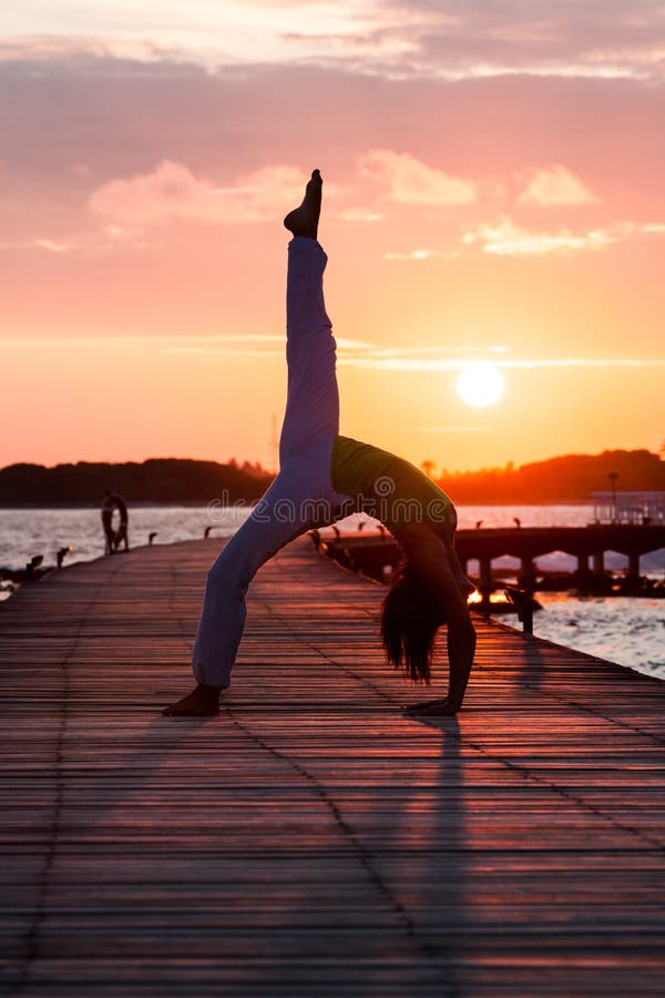 Woman Stretches Yoga Sunset Silhouette Stock Photo - Image of ...