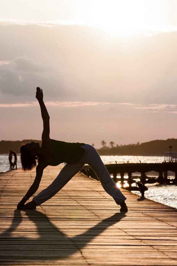 Yoga Practice during Sunset Stock Photo - Image of malediven, exercise ...