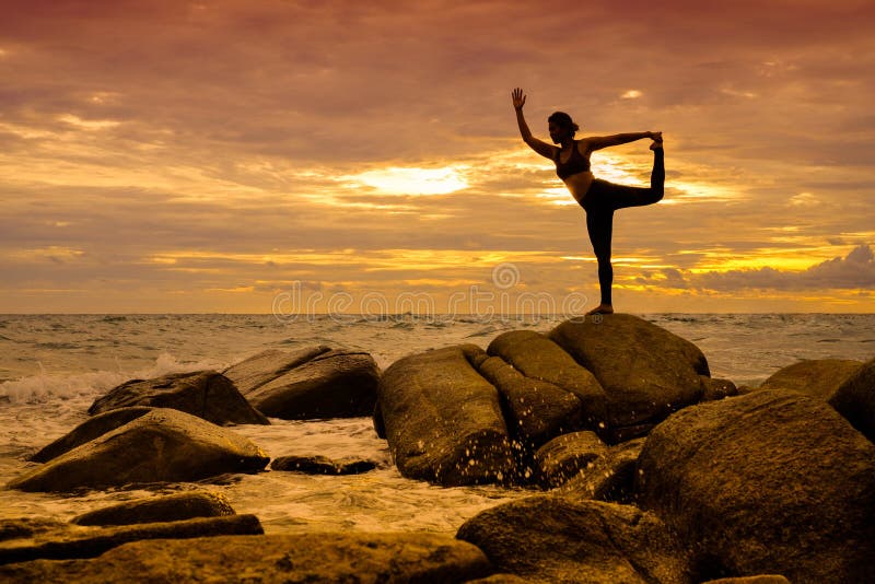 Yoga on the Rock at the Sunset with the Murmur of Waves. Stock Image ...