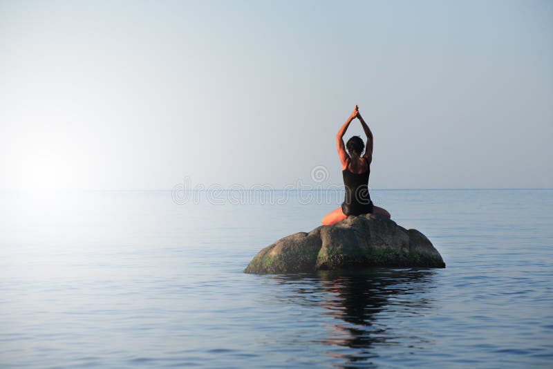 Yoga in the Sea stock photo. Image of relaxation, wellbeing - 25629534
