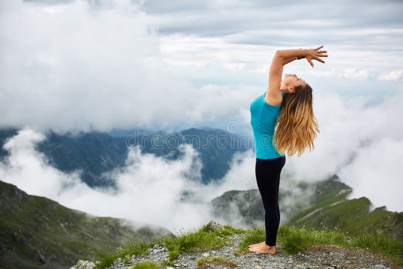Yoga at summit stock image. Image of female, meditating - 26539977
