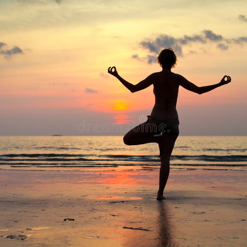 Woman Doing Yoga Exercise at Sunset Stock Photo - Image of meditating ...