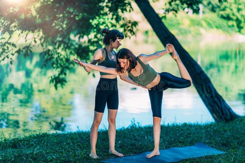 Yoga Women by the Water. Boat Pose Stock Photo - Image of tranquility ...