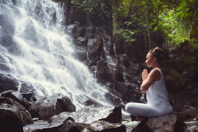 Yoga on the waterfall stock photo. Image of gymnastics - 101944208
