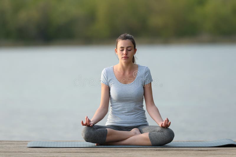 Yogi Doing Yoga Exercise in a Lake or Beach Stock Photo - Image of ...