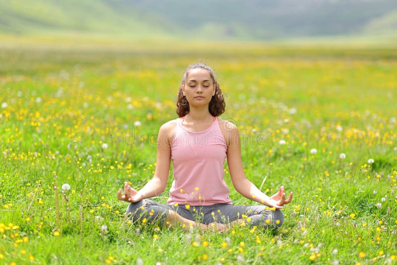 Yogi Doing Yoga on the Grass in the Mountain Stock Image - Image of ...