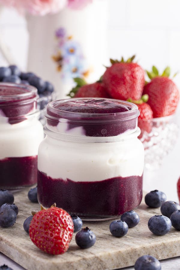 Yogurt and Berry Puree in a Glass Jar for Breakfast Stock Image - Image ...