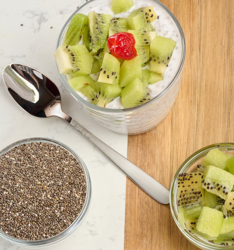 Yogurt and Chia Seed Pudding in a Glass, Kiwi Pieces. White Table Stock ...