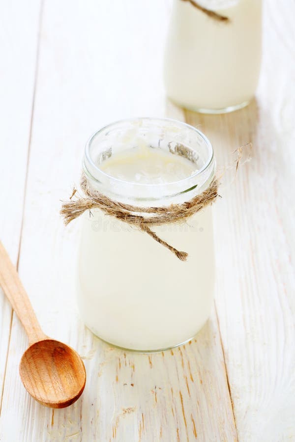 Yogurt in a glass jar stock image. Image of closeup, glass - 37153673