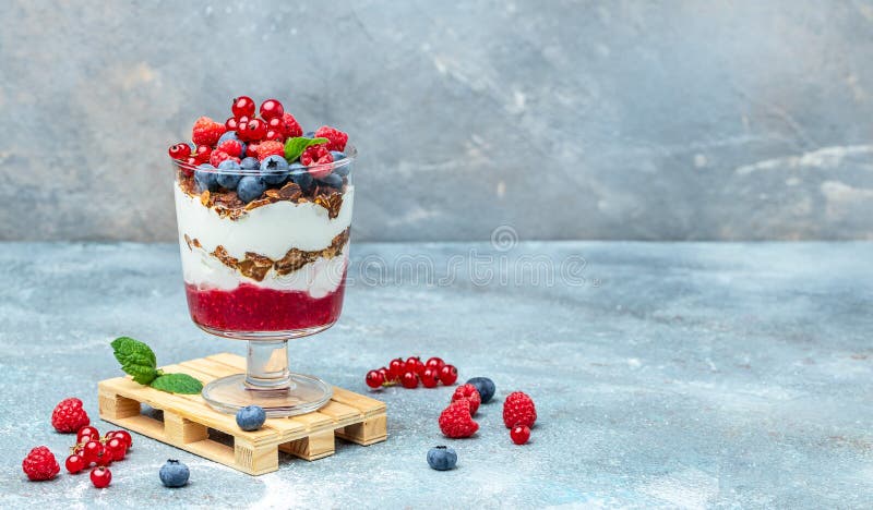 Yogurt Granola Parfait with Blueberry and Raspberry on a Light ...